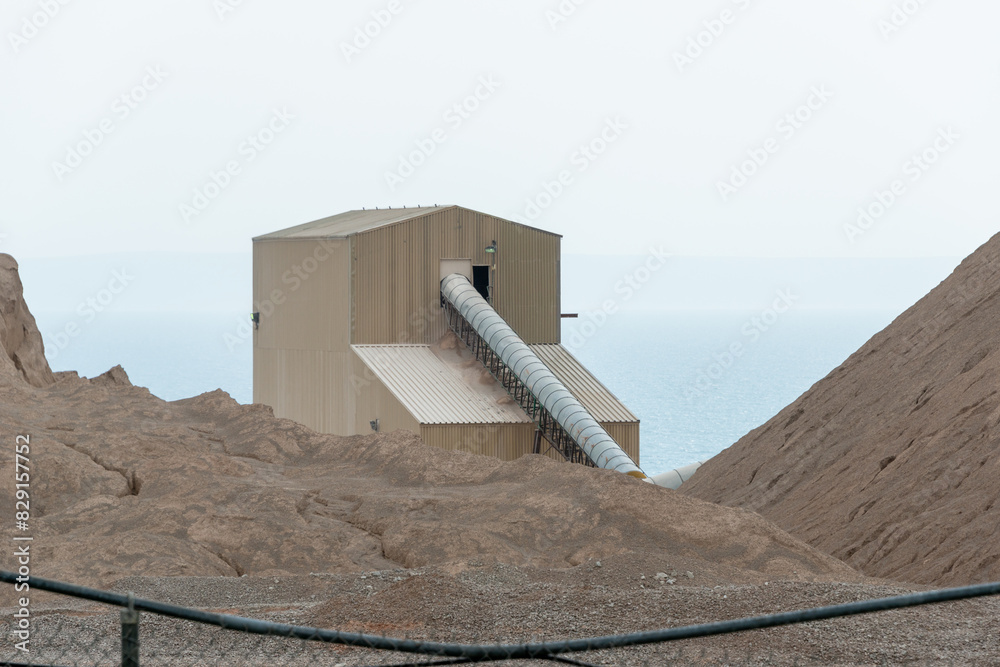 A stockpile of limestone mined in an above ground quarry. The beige ...
