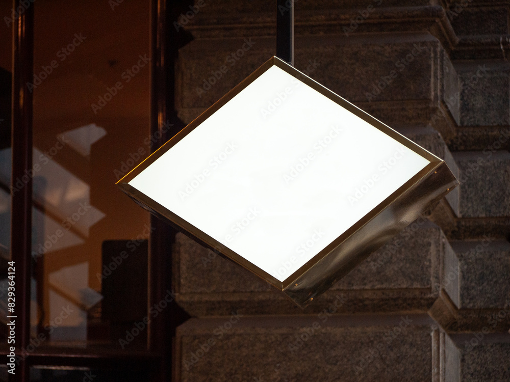 An illuminated diamond-shaped display or a Rhombus lightbox sign, with ...