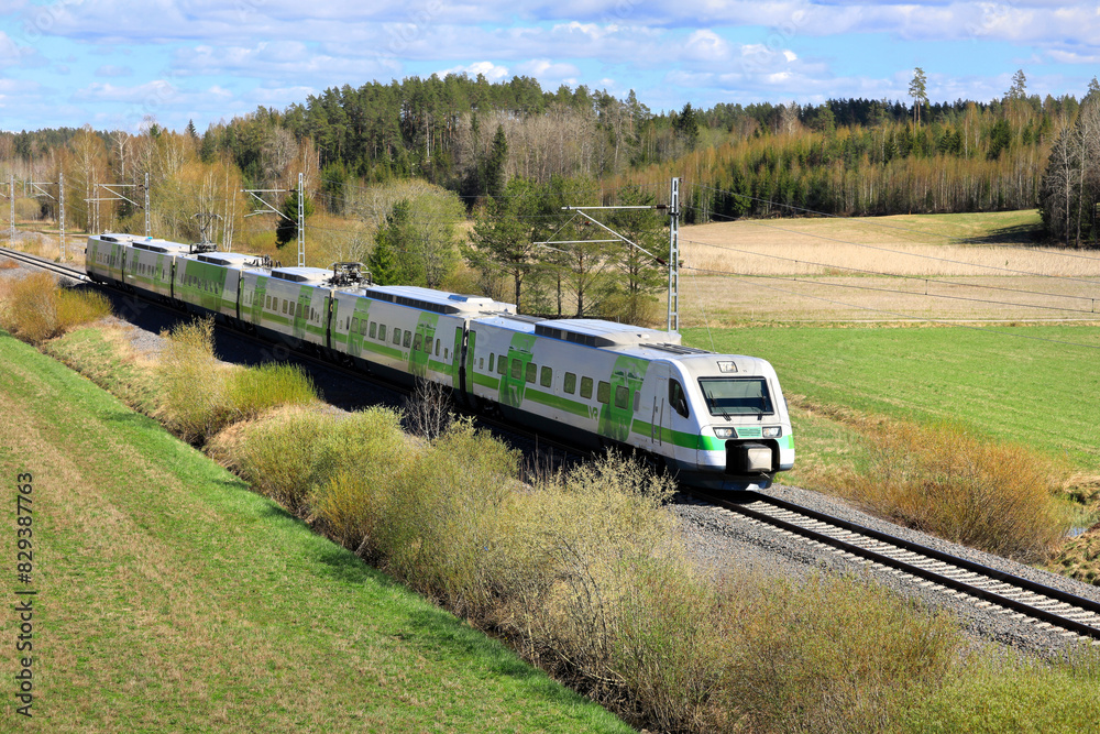 Pendolino Express Train of VR Group Travels Through Finnish Countryside in the Spring. Stock ...