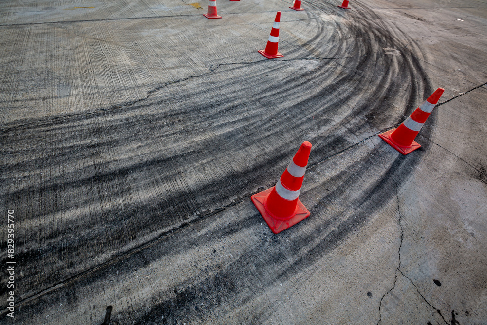 Race track road with tire mark skid road Backgroundn and traffic cone ...