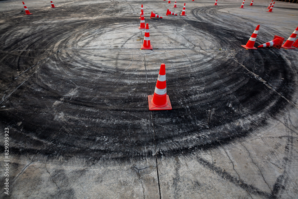 Race track road with tire mark skid road Backgroundn and traffic cone ...