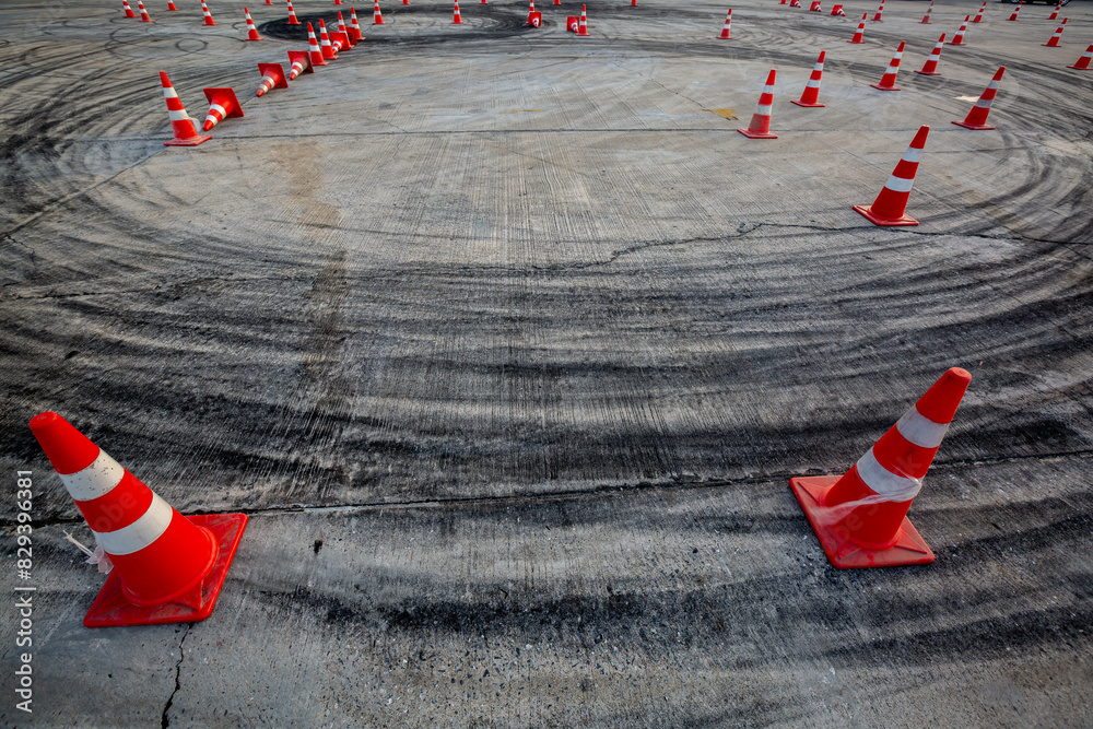 Race track road with tire mark skid road Backgroundn and traffic cone ...