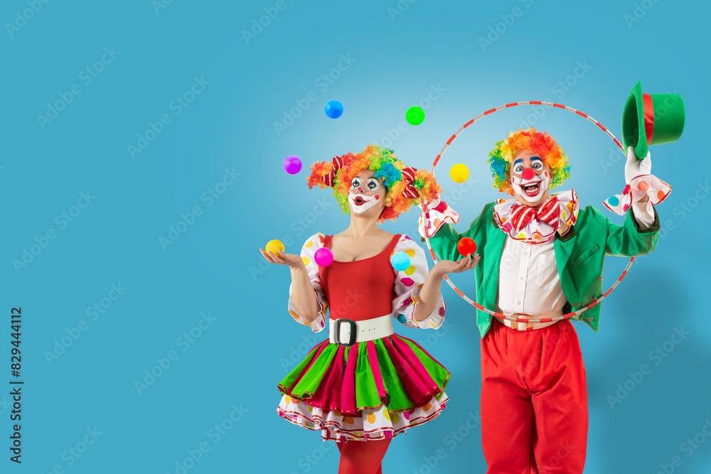 Poster Funny juggler female clown juggling balls in the circus, man ...