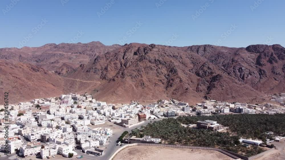 Drone Shot of the Uhud Mountain and the Settlement with Palm Trees at ...