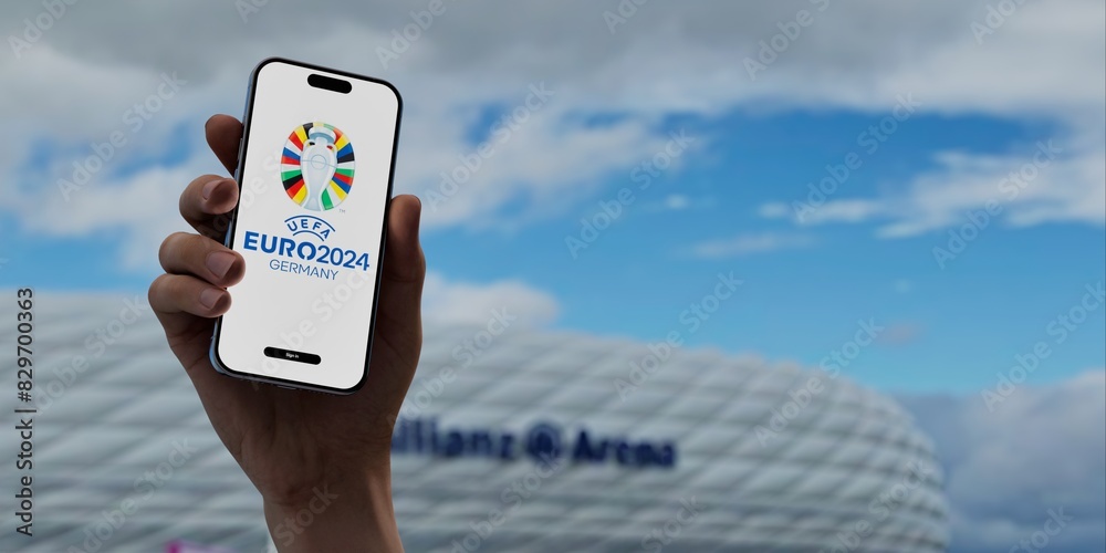 Euro 2024 app on a screen, against the backdrop of a Allianz Arena ...