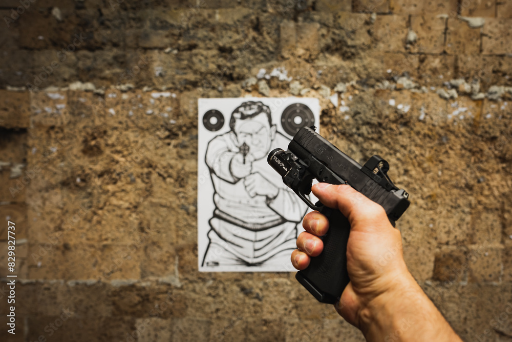 Baltic States, May 23, 2024. Shooting from a Glock 43x pistol at a ...