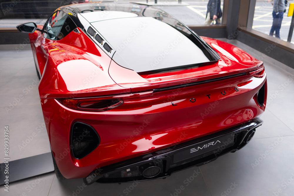 red Lotus Emira in showroom, British exciting sports car Lotus Cars ...