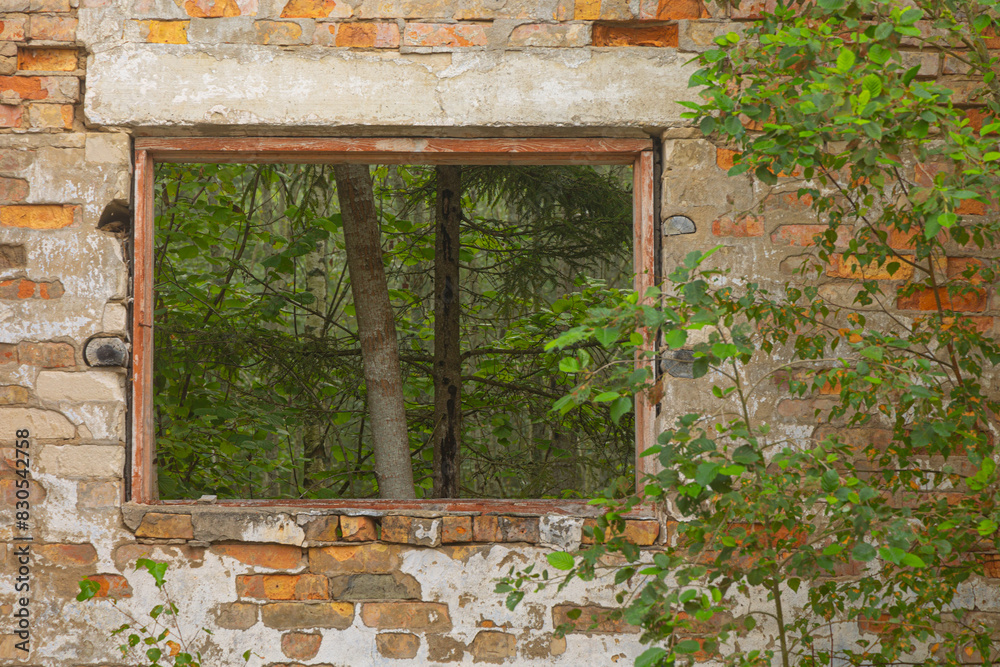 A broken, empty window of building ruins from Soviet times. Collapsed ...