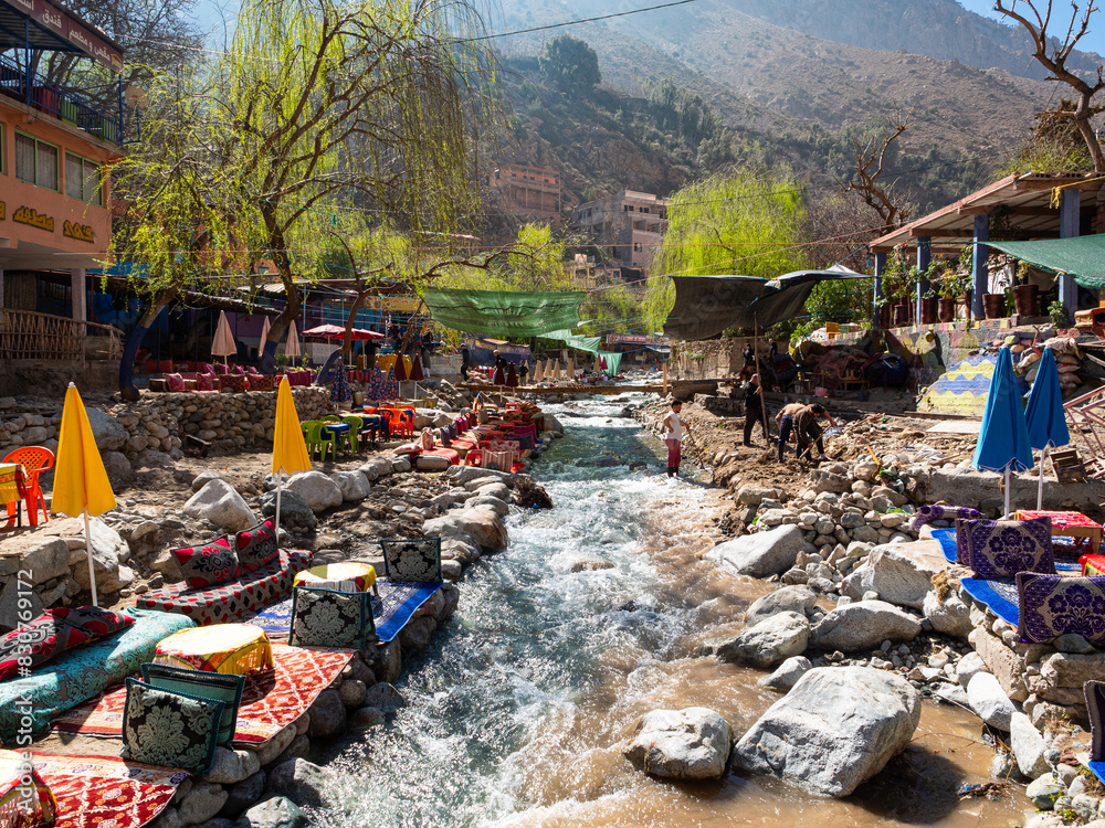 Poster Riverside tables and eating spaces at colourful waterside ...