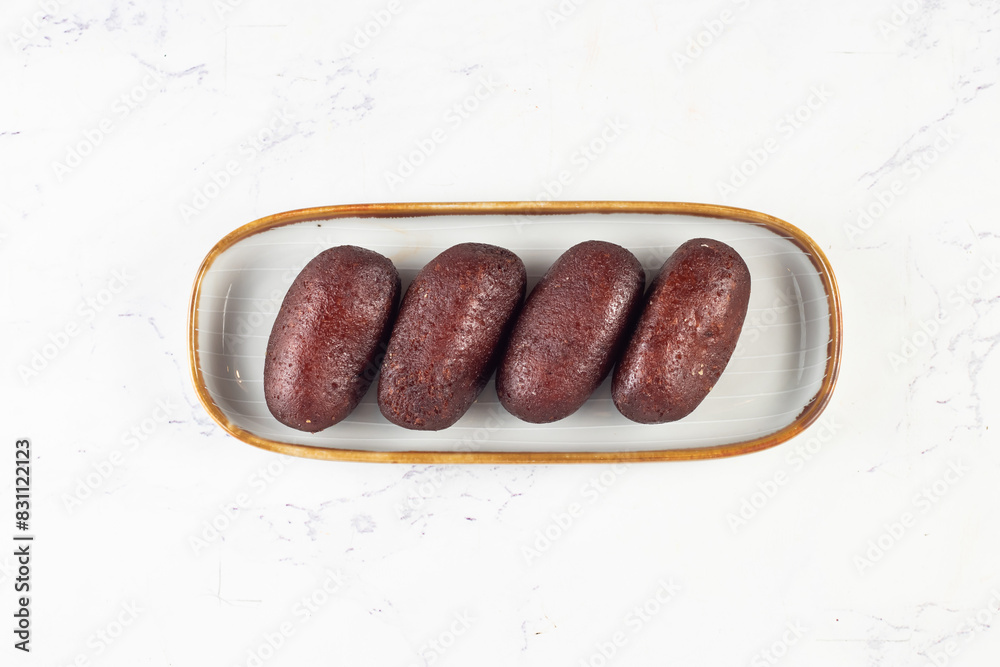 Gulab Jamun, kalo jam or mohan served in tray dish isolated on marble ...
