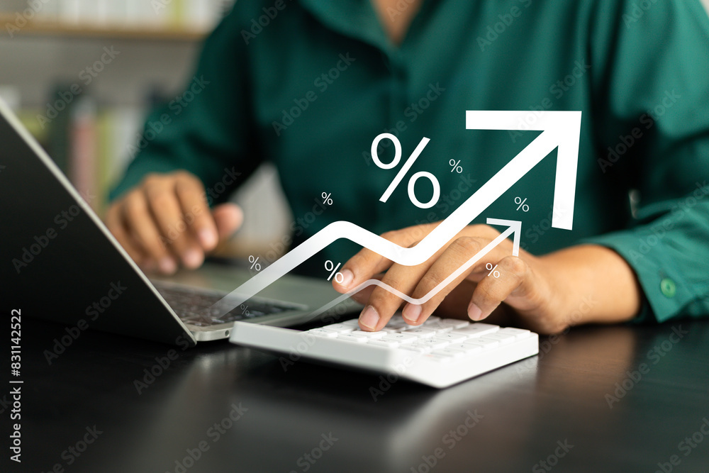 Interest rate concept, Business man using calculator with graph ...