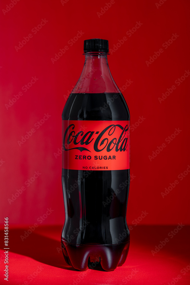 Plastic bottle of Zero Coca-Cola with label and trademark on on red ...