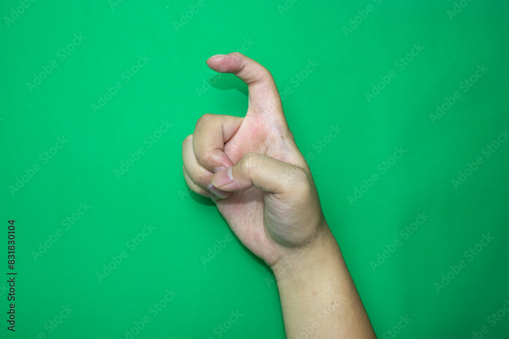 hand showing sign, sign language of alphabet of X, on green background ...