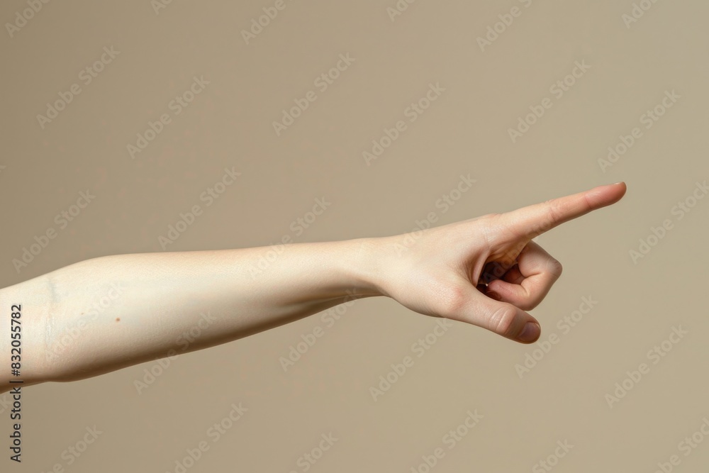 Finger pointing hand gesture. Female arm with elegant forefinger ...
