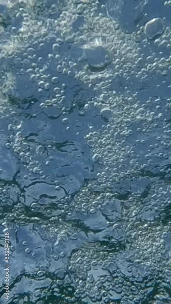 Vertical video, Underwater view of beginning of heavy tropical rain in ...