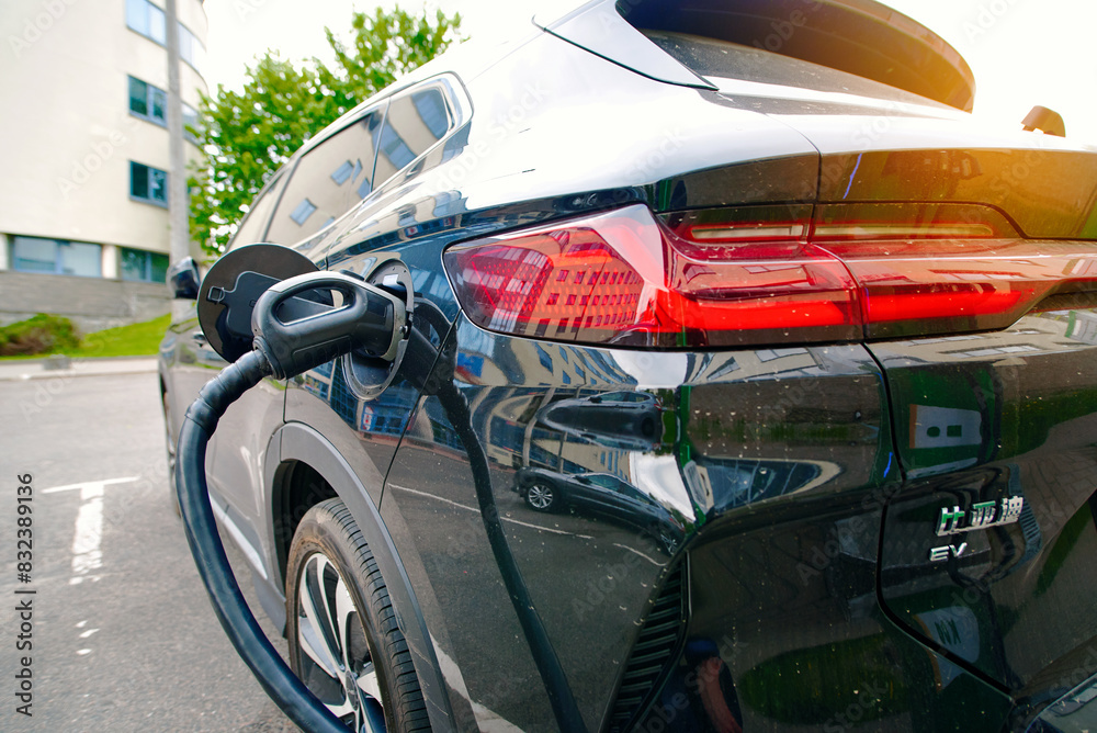 Minsk, Belarus. May 9, 2024. Charging BYD EV vehicle, connect EV plug ...