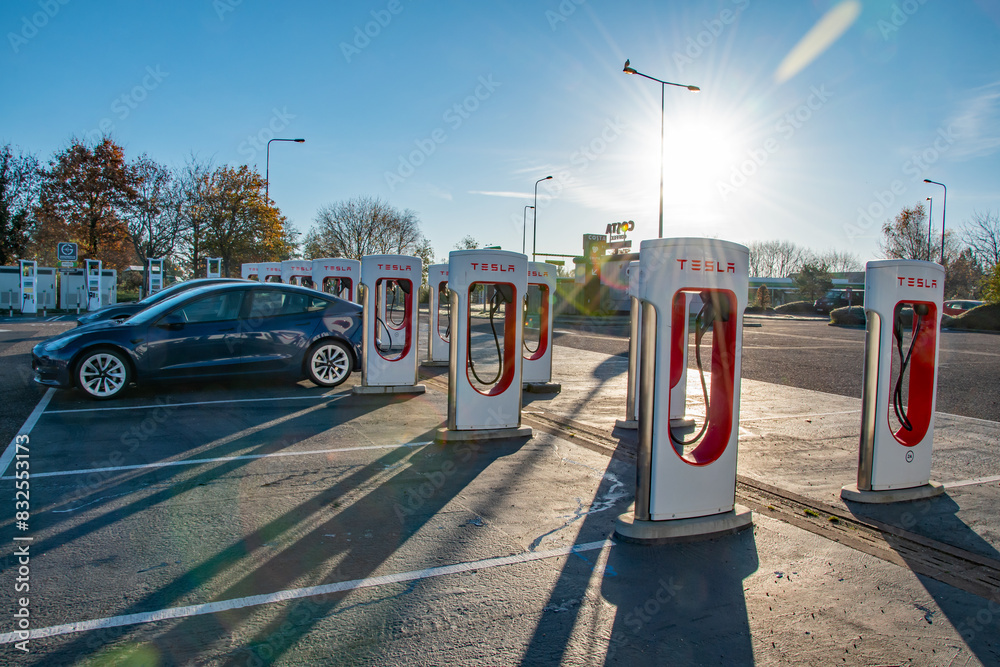 Exeter, Devon, uk. 11-25-23. Tesla electric vehicles charging at Tesla ...