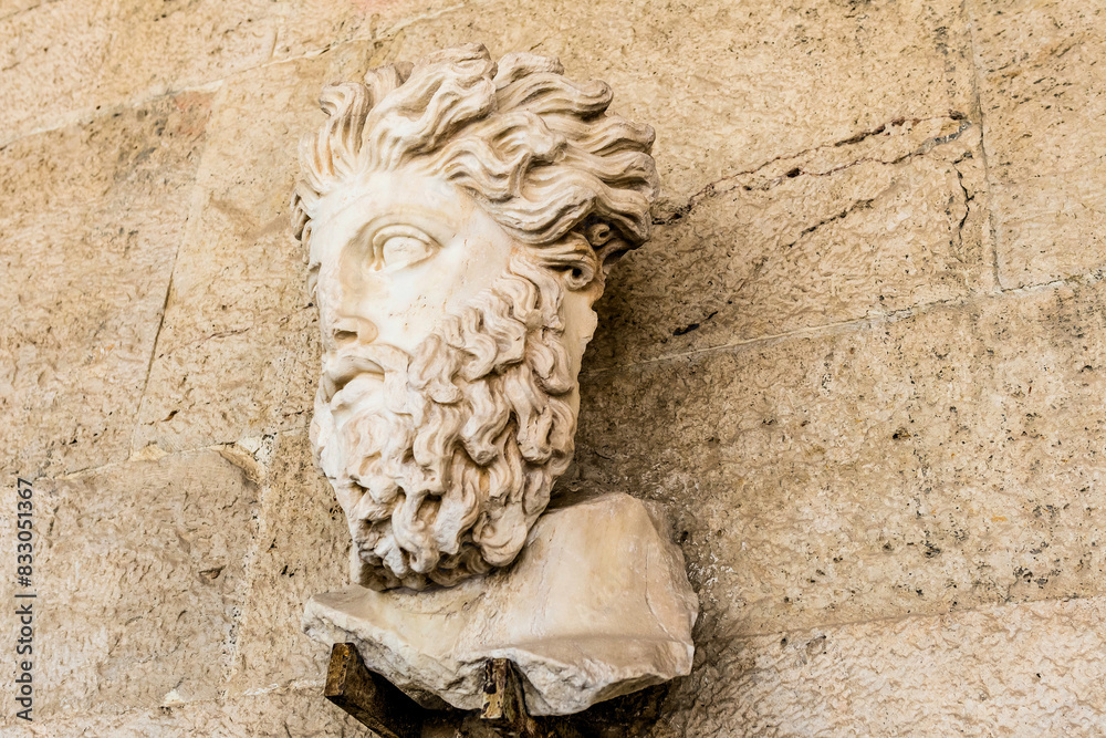 Marble bust of a Triton from the Odeion of Agrippa hanging on museum ...