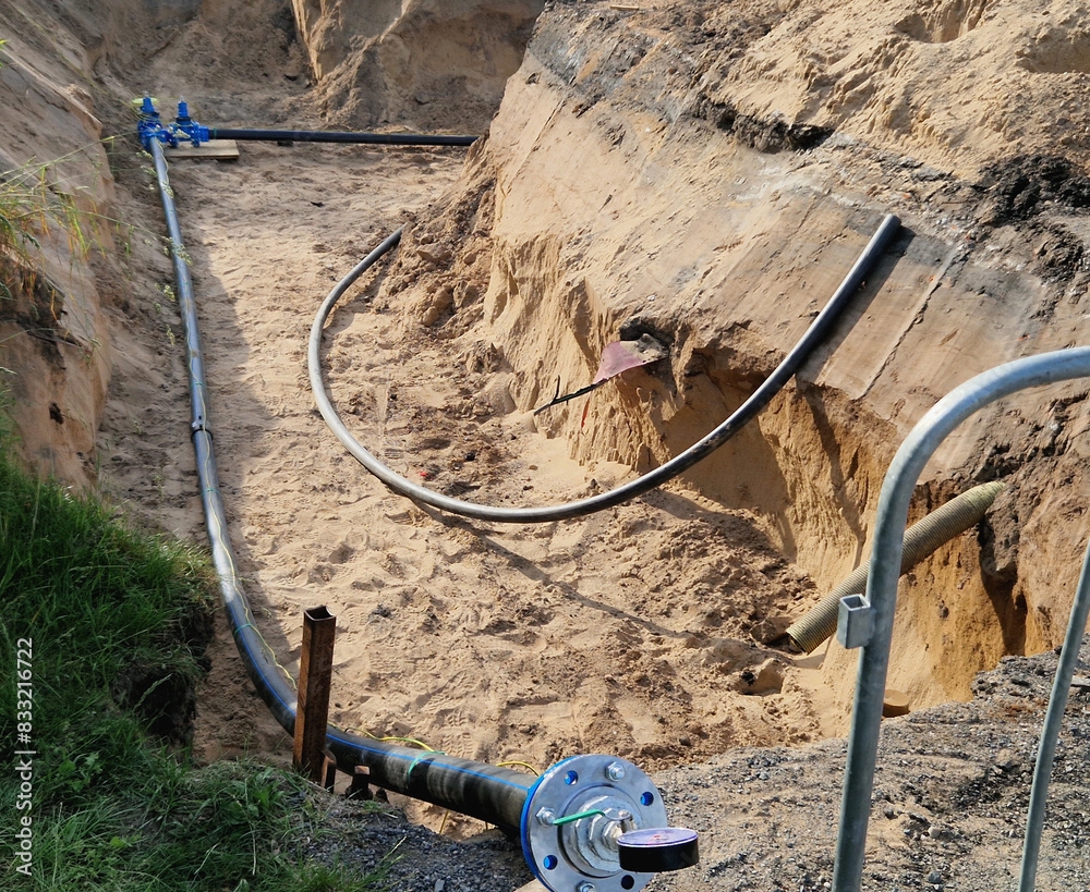 repair of water supply, gas connection in deep excavation. the pipe is ...