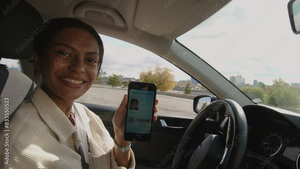 Medium Close-up portrait of young smiling biracial lady sitting in ...