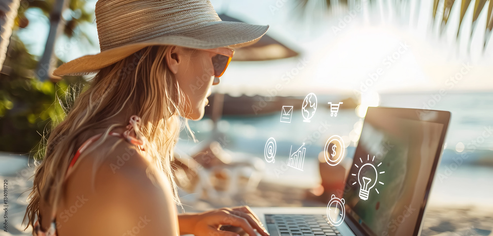 Woman on summer vacation on the beach using her laptop next to work ...