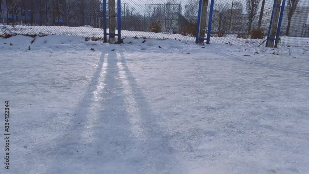 Ice on the walking path. Top view of an icy road. High-quality shooting ...