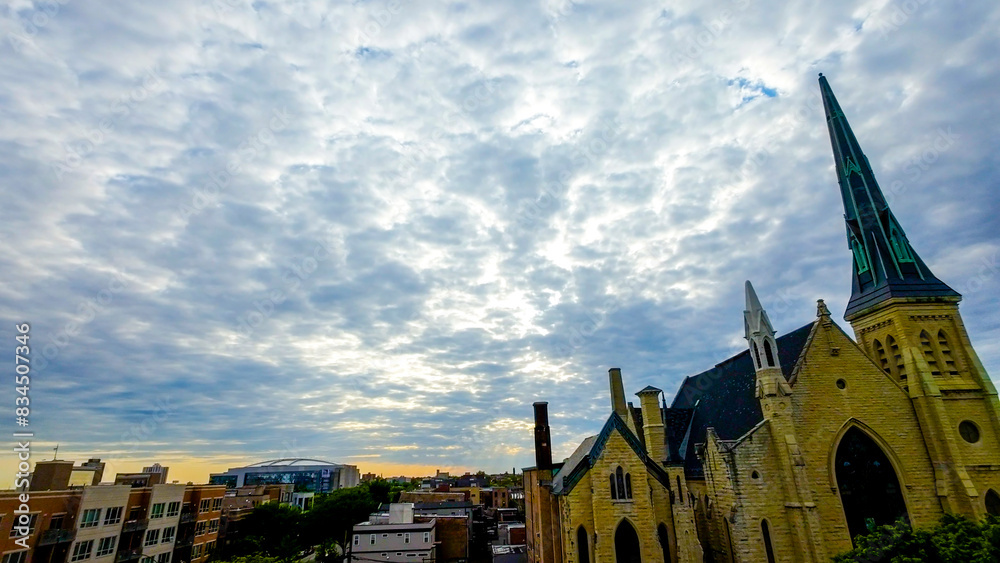 Stunning view of a historic church with a tall spire against a dramatic ...