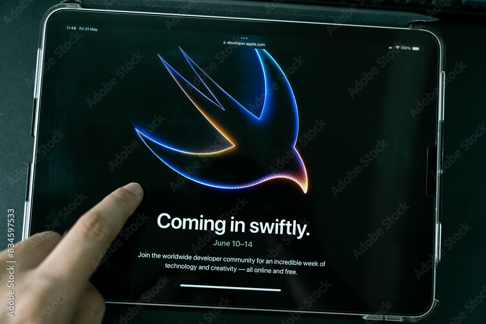Cover of WWDC 2024 on the screen of the iPad. WWDC is Apple's annual ...