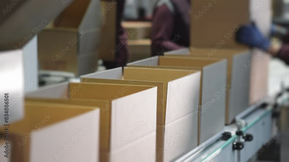 Automated production conveyor line at the modern factory. Carrying the ...