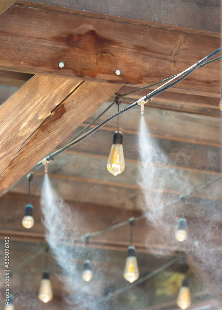 Water spray system for cooling the terrace on a hot summer day. Fogging ...
