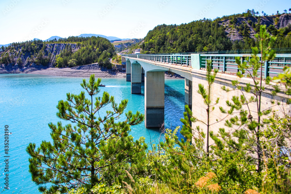 Bridge crossing the Riou-Bourdou river on the north shore of the lake ...