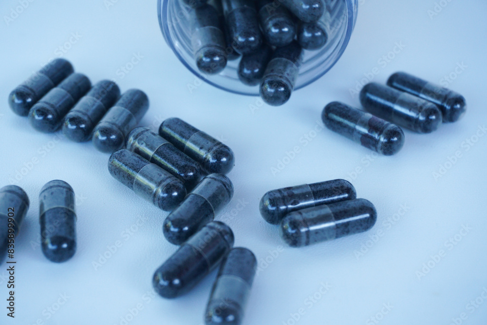 Black cumin capsules or commonly called (Habbatussauda) are isolated on ...