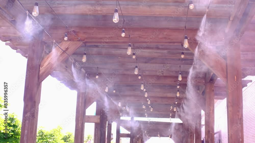 Water spray system for cooling the terrace on a hot summer day. Fogging ...