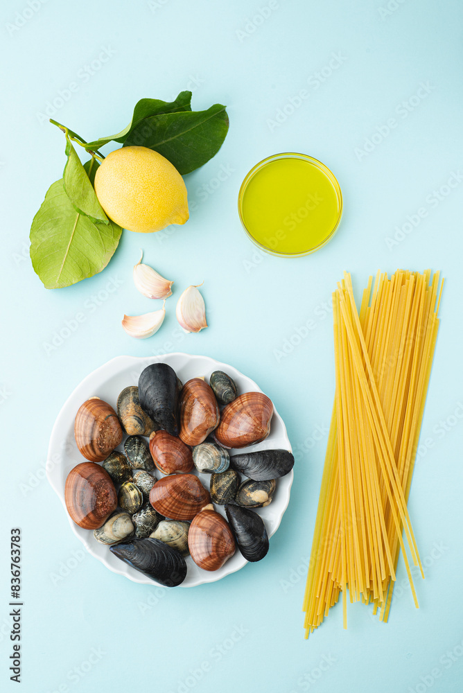 Ingredients for pasta spaghetti with shells and lemon peel: mussels ...