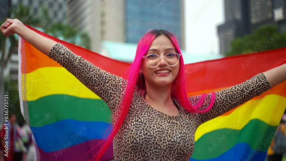 LGBTQ female with pink hair celebration moment on Pride month Parade of ...
