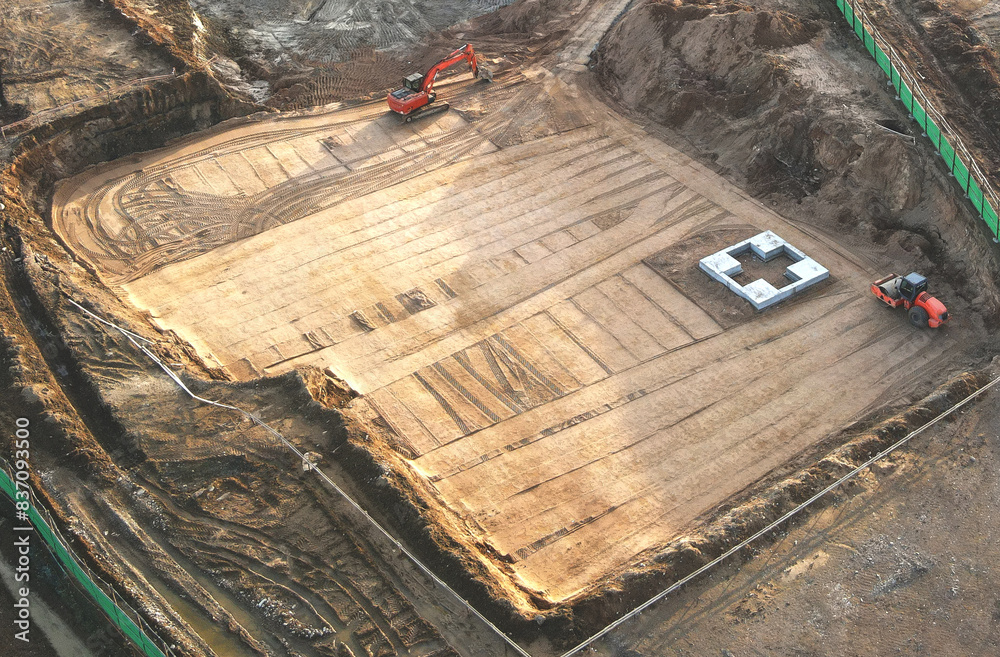 Drone view of construction site. Vibration road roller leveling the ...