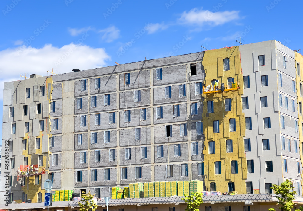 Facade Insulation. Suspended cradle mobile scaffolding platform for ...