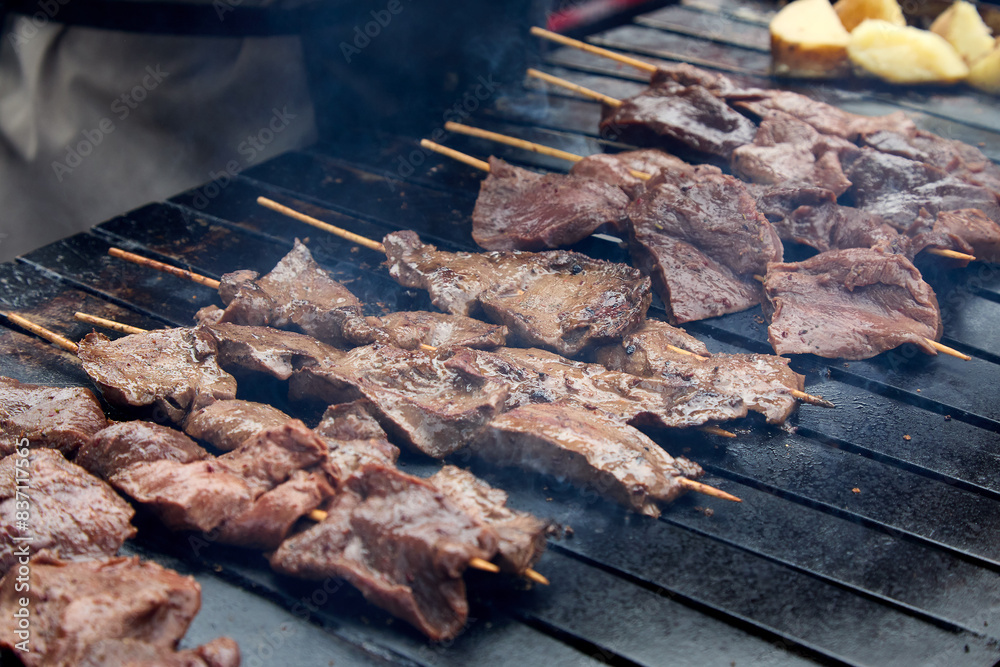 Anticuchos are typically grilled over an open flame, giving the meat a ...