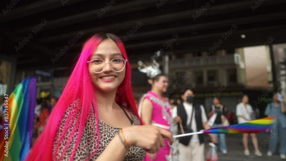 Celebration moment LGBTQ female with pink hair on Pride month Parade of ...