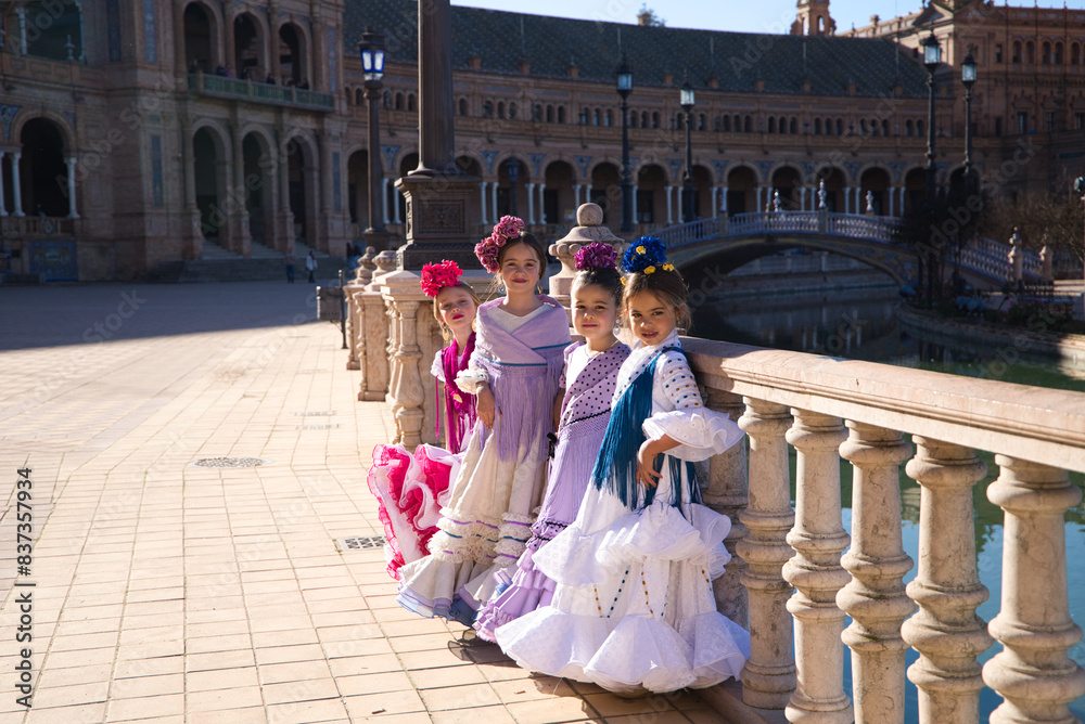 four pretty little girls dancing flamenco dressed in typical gypsy ...