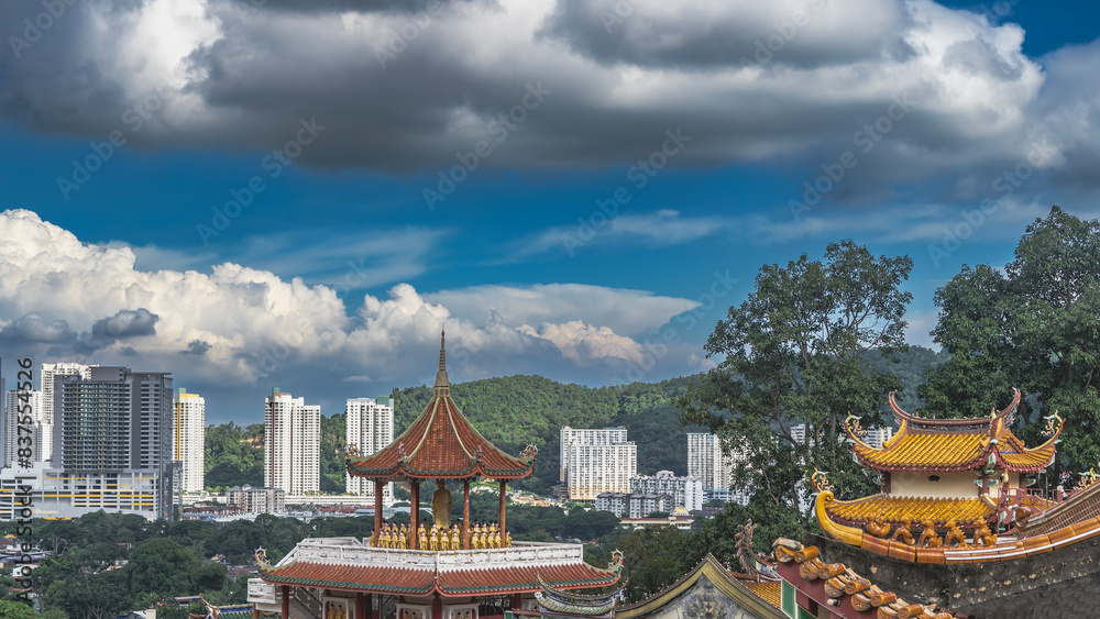 A Chinese temple. The roofs with elegantly curved edges are decorated ...