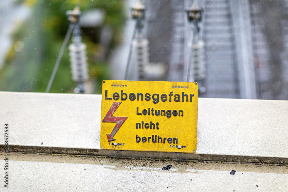 High voltage warning sign saying beware of life danger, dont touch ...
