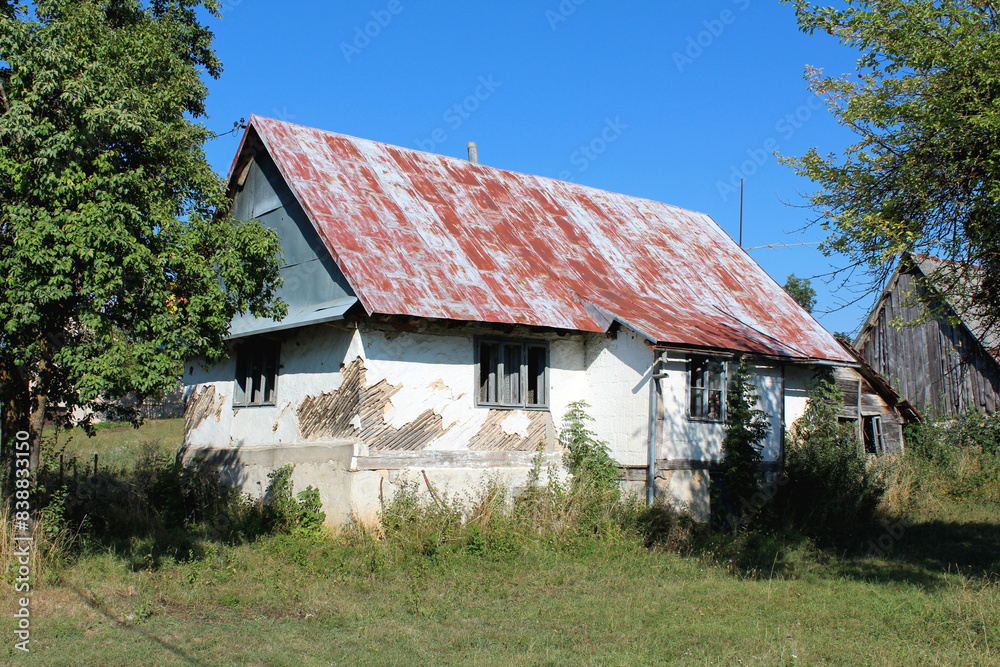 Abandoned small old vintage urban family house with destroyed white ...