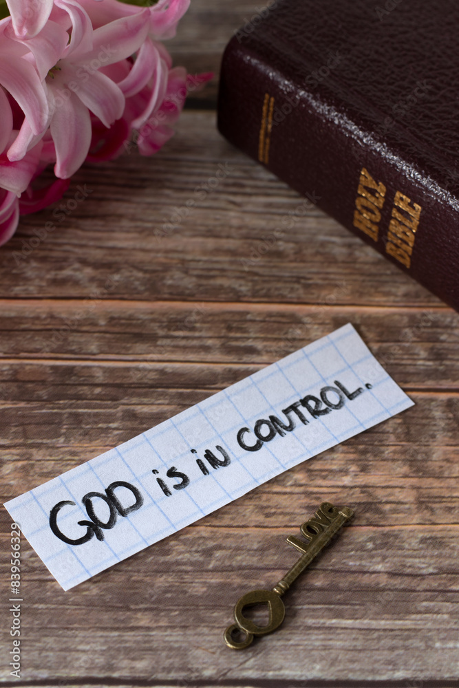 God is in control, handwritten quote with holy bible book, ancient key ...