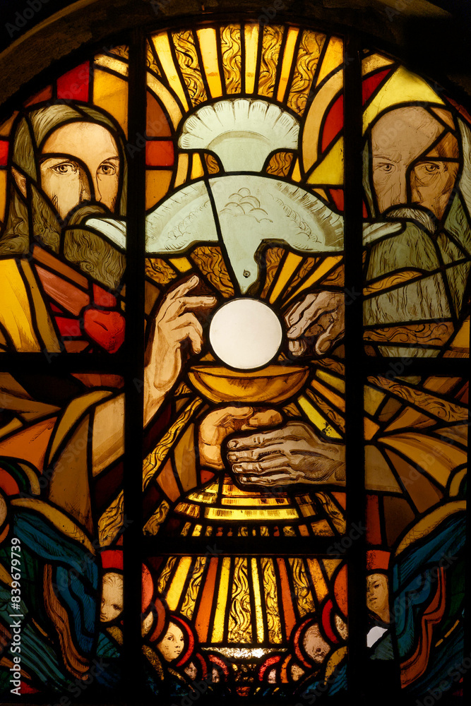 stained glass window depicting a dove of peace symbolizing the holy ...