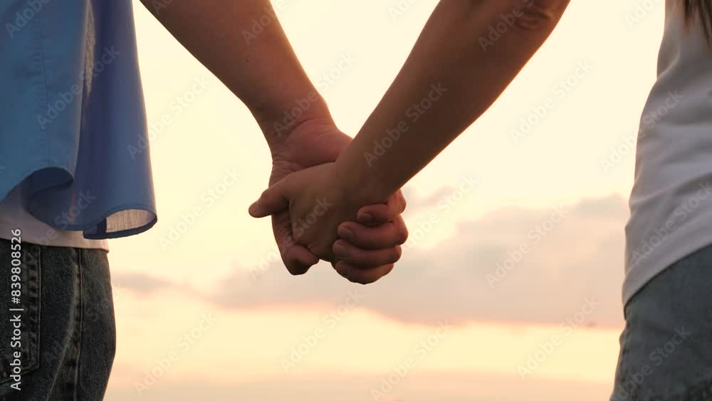 Couple man and woman taking hands to each other at sunset sky summer ...