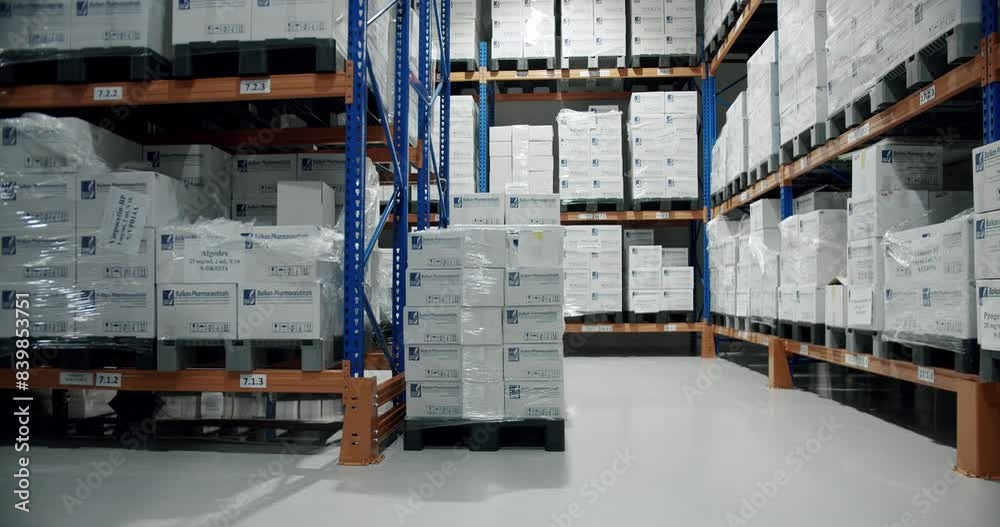 Logistics center interior full of racks with with large number packs ...