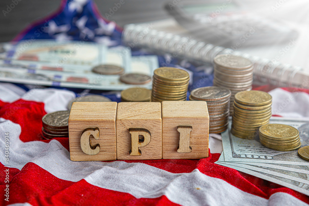 CPI, consumer price index symbol. Wooden blocks with words CPI, consumer price index on dollar ...