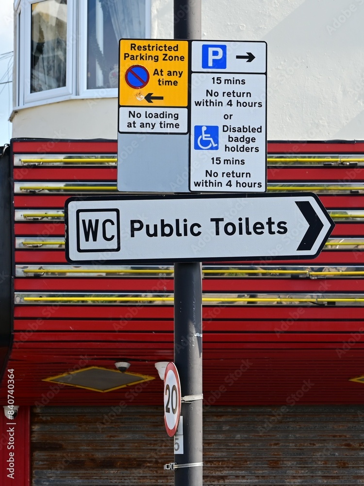 English parking regulation and rest room road sign. Stock Photo | Adobe ...