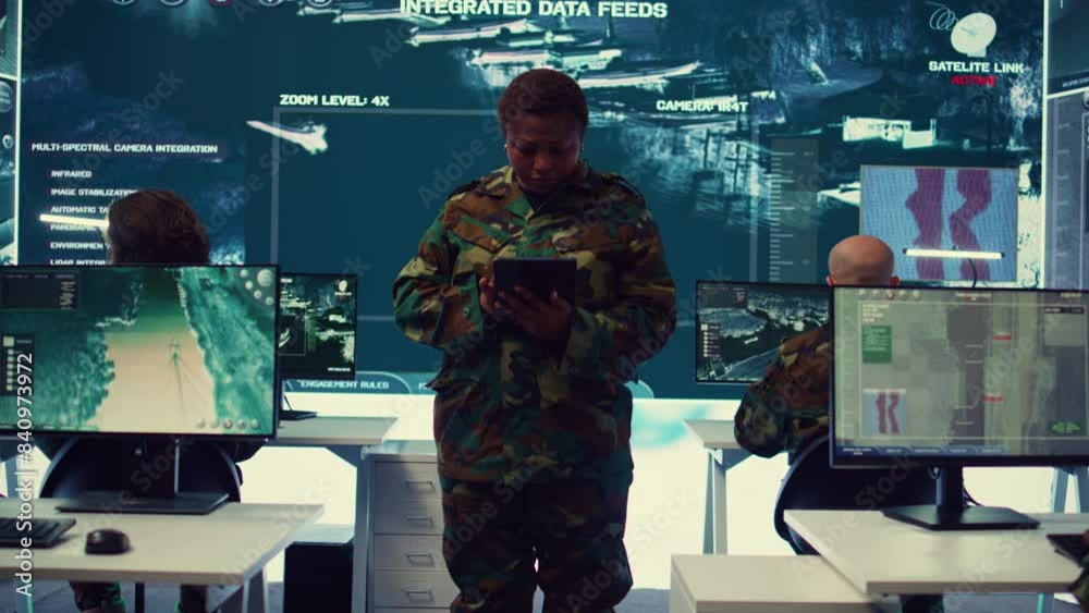 Woman sergeant major working on deployment of electronic warfare tools ...